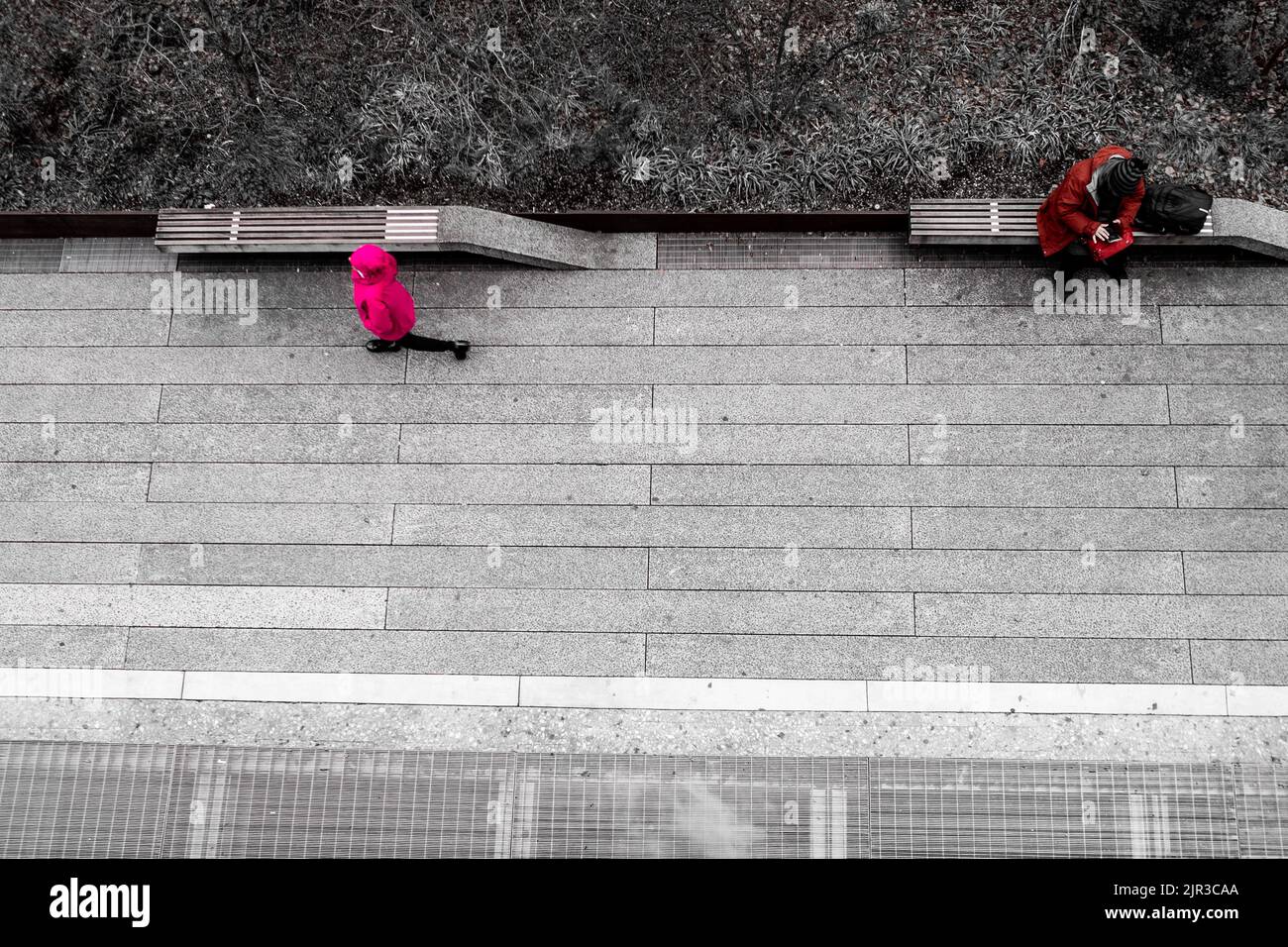 Person in pink walking on pavement, top view Stock Photo - Alamy