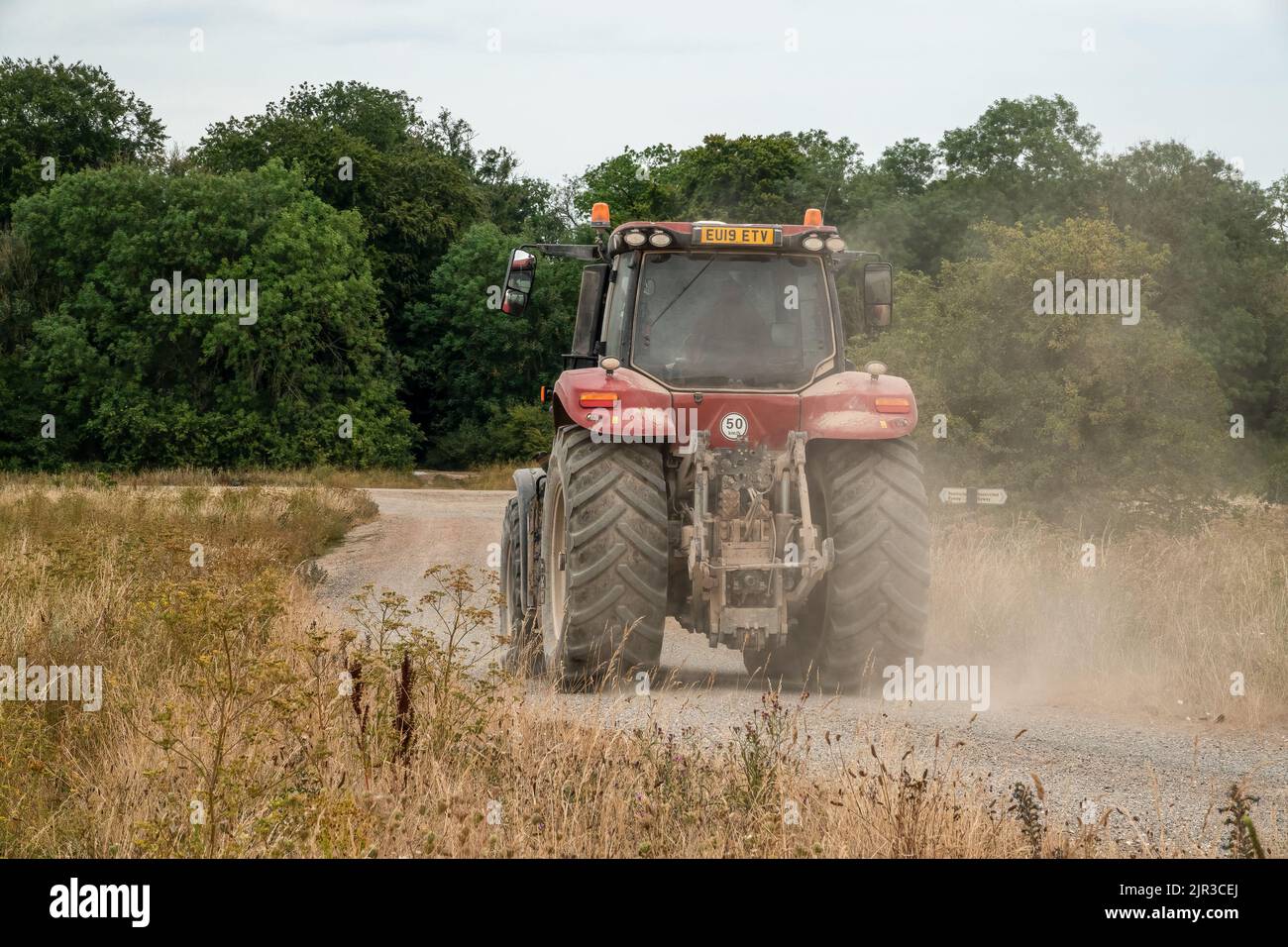 red Case Puma 340 red tractor in action on a dusty stone track Stock ...