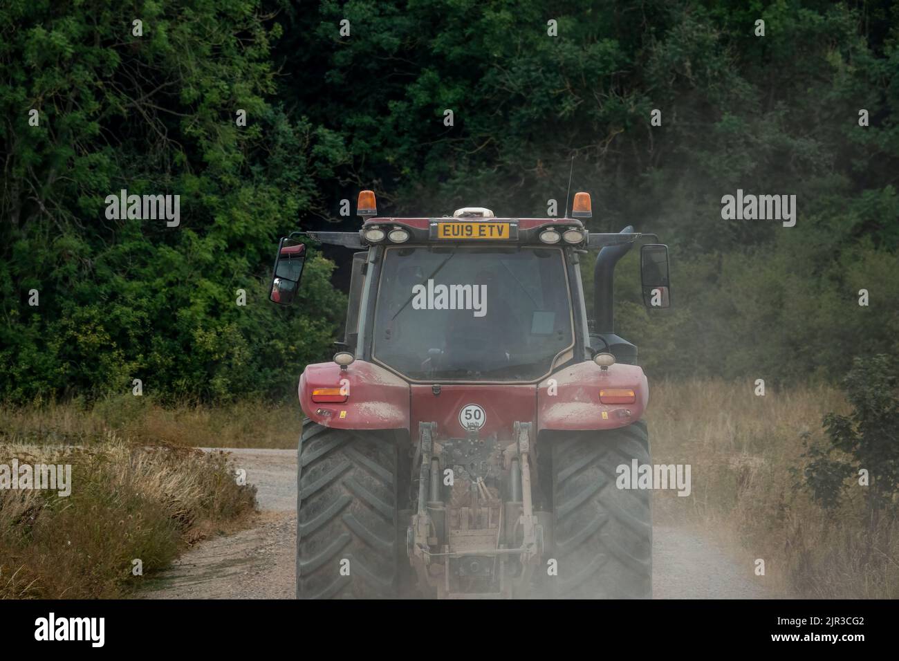red Case Puma 340 red tractor in action on a dusty stone track Stock ...