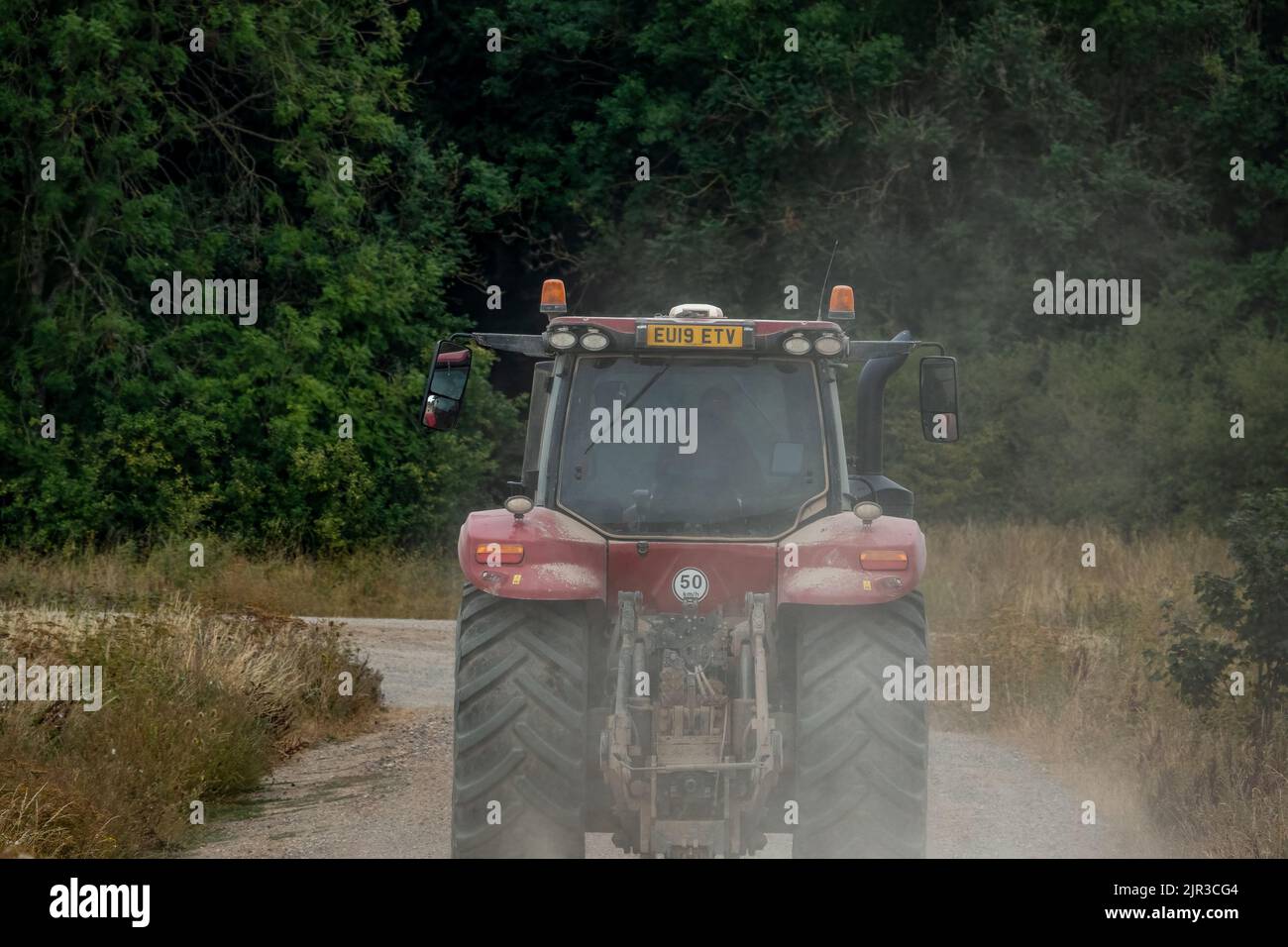 red Case Puma 340 red tractor in action on a dusty stone track Stock ...