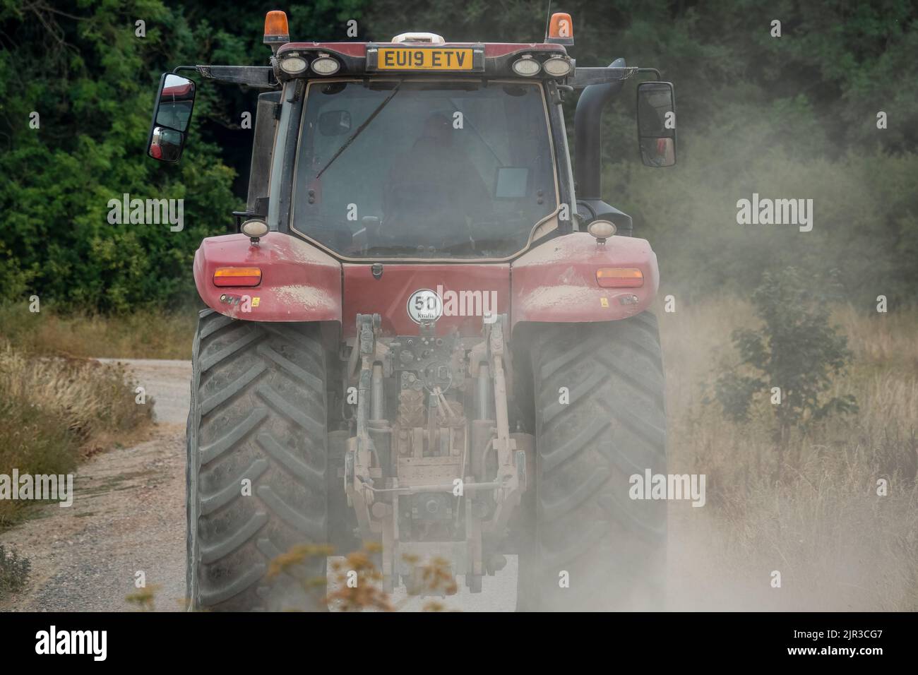 red Case Puma 340 red tractor in action on a dusty stone track Stock ...