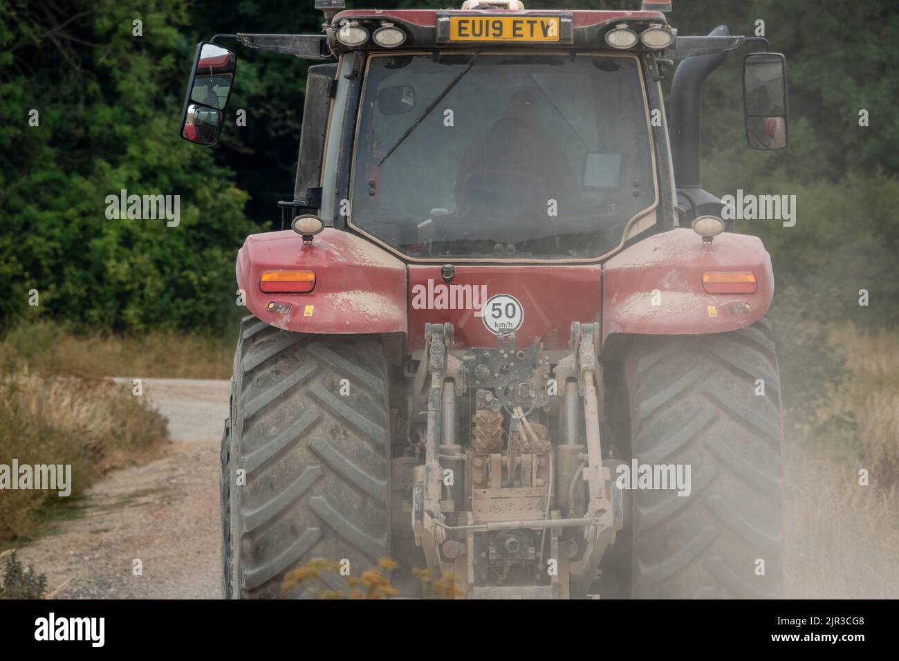 red Case Puma 340 red tractor in action on a dusty stone track Stock ...