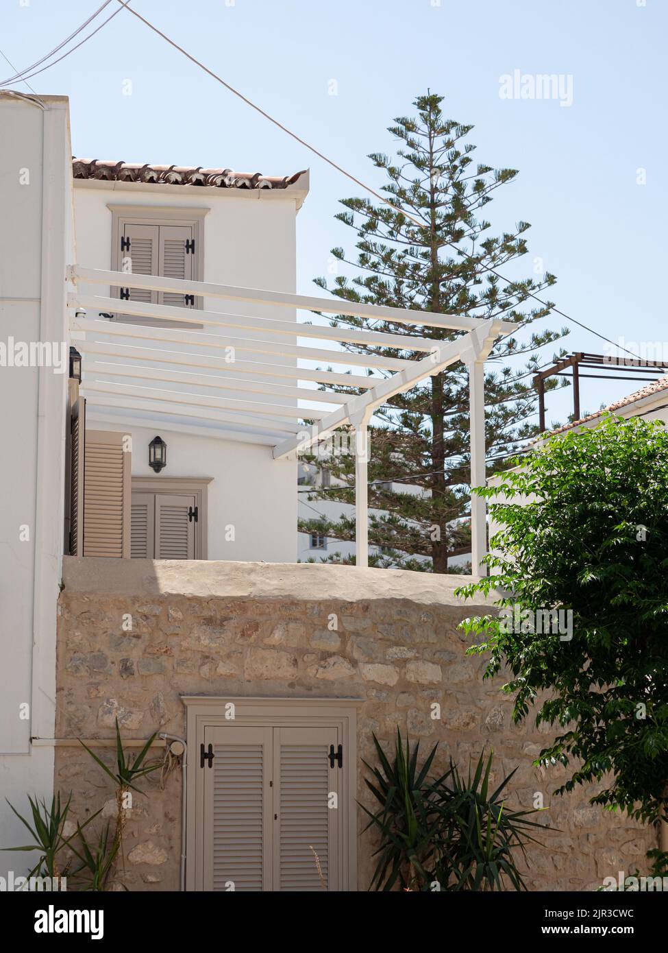 Greek villa, beige latte shutters, beautiful exterior and veranda Stock ...