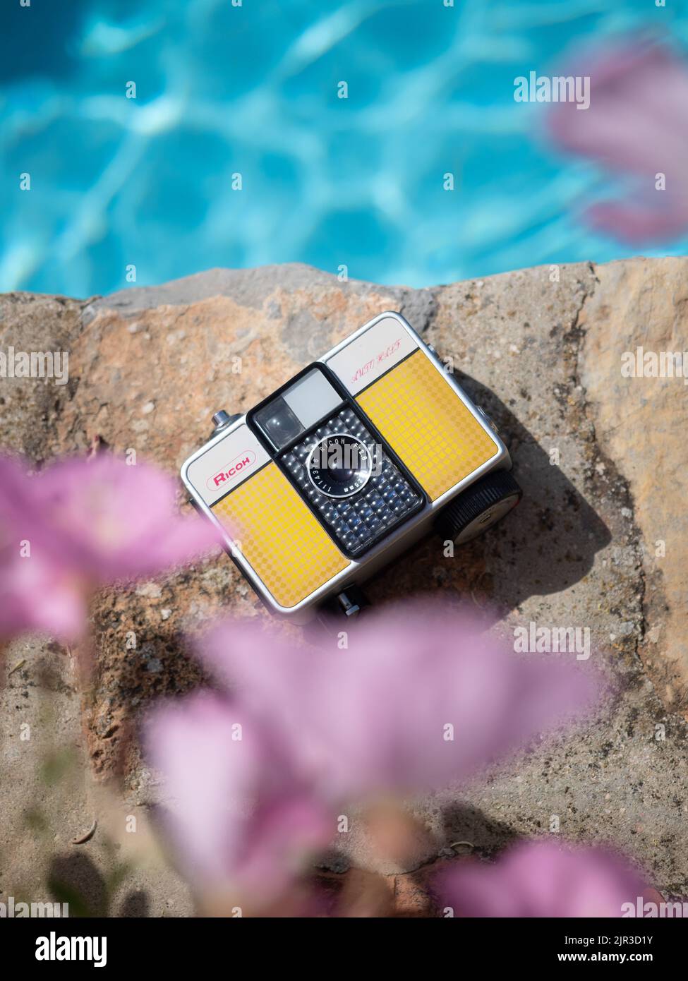 Yellow retro vintage Ricoh camera holiday photos on Greek island Stock ...