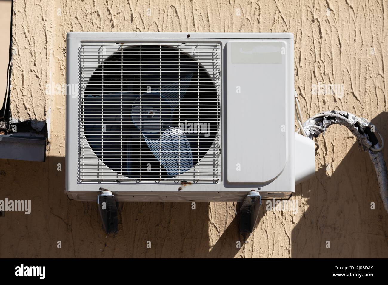 outdoor air conditioner unit on the wall of a building Stock Photo - Alamy