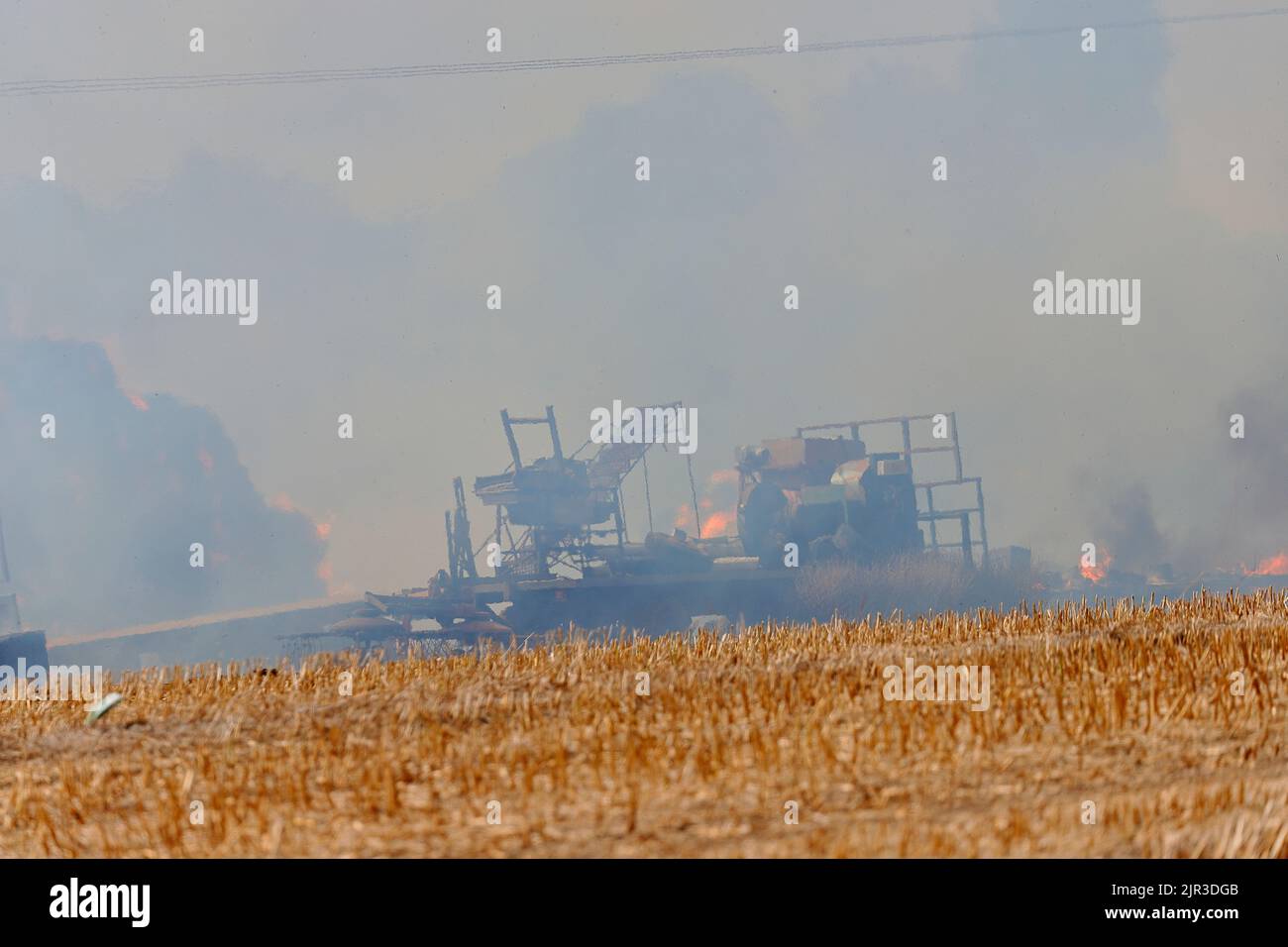 A piece of damaged farming machinery after being caught in a hay stack ...