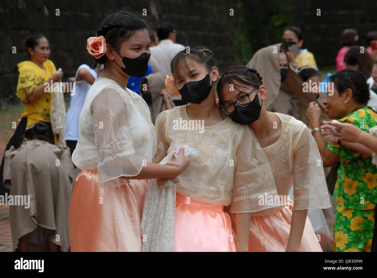 Girls resting after dancing as part of religious festival, Fort ...