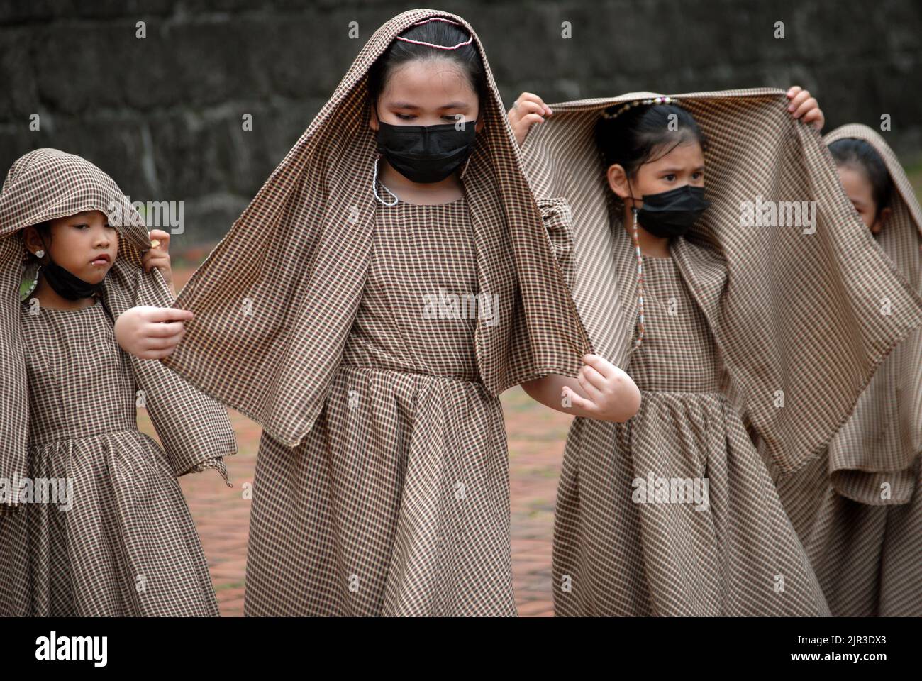 Children dancing as part of religious ceremony, Fort Santiago, Manila ...