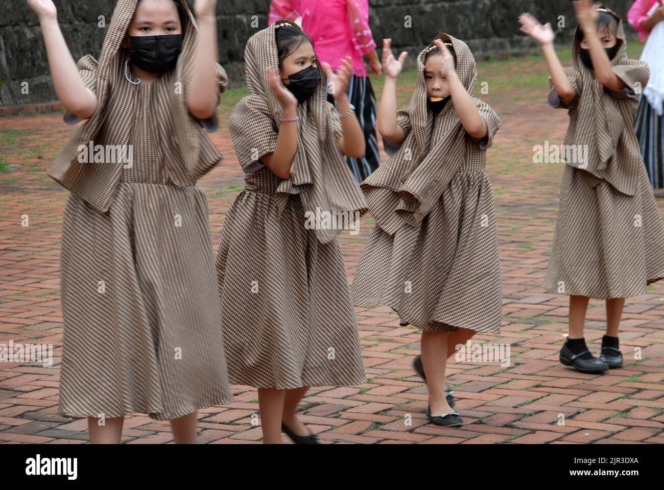 Children dancing as part of religious ceremony, Fort Santiago, Manila ...