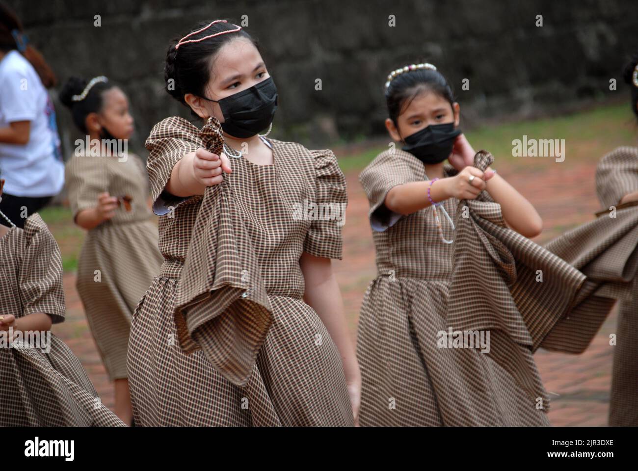 Children dancing as part of religious ceremony, Fort Santiago, Manila ...