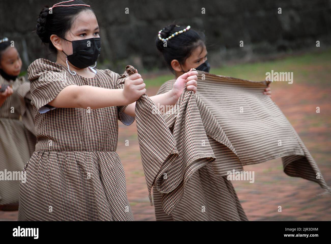 Children dancing as part of religious ceremony, Fort Santiago, Manila ...