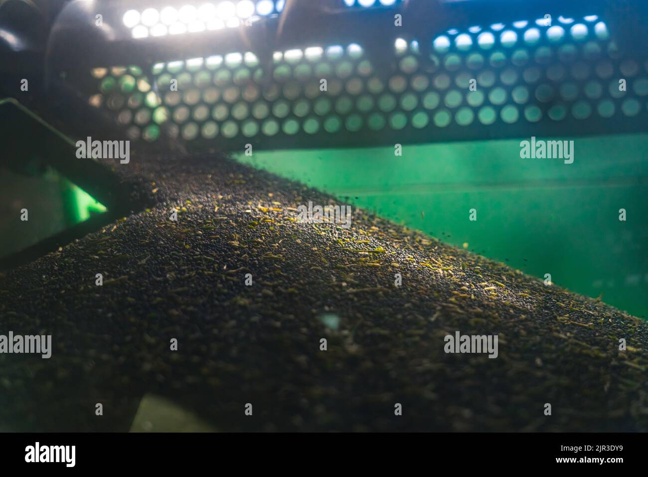 Rapeseed harvesting season. Dark inside of a combine harvester filled ...