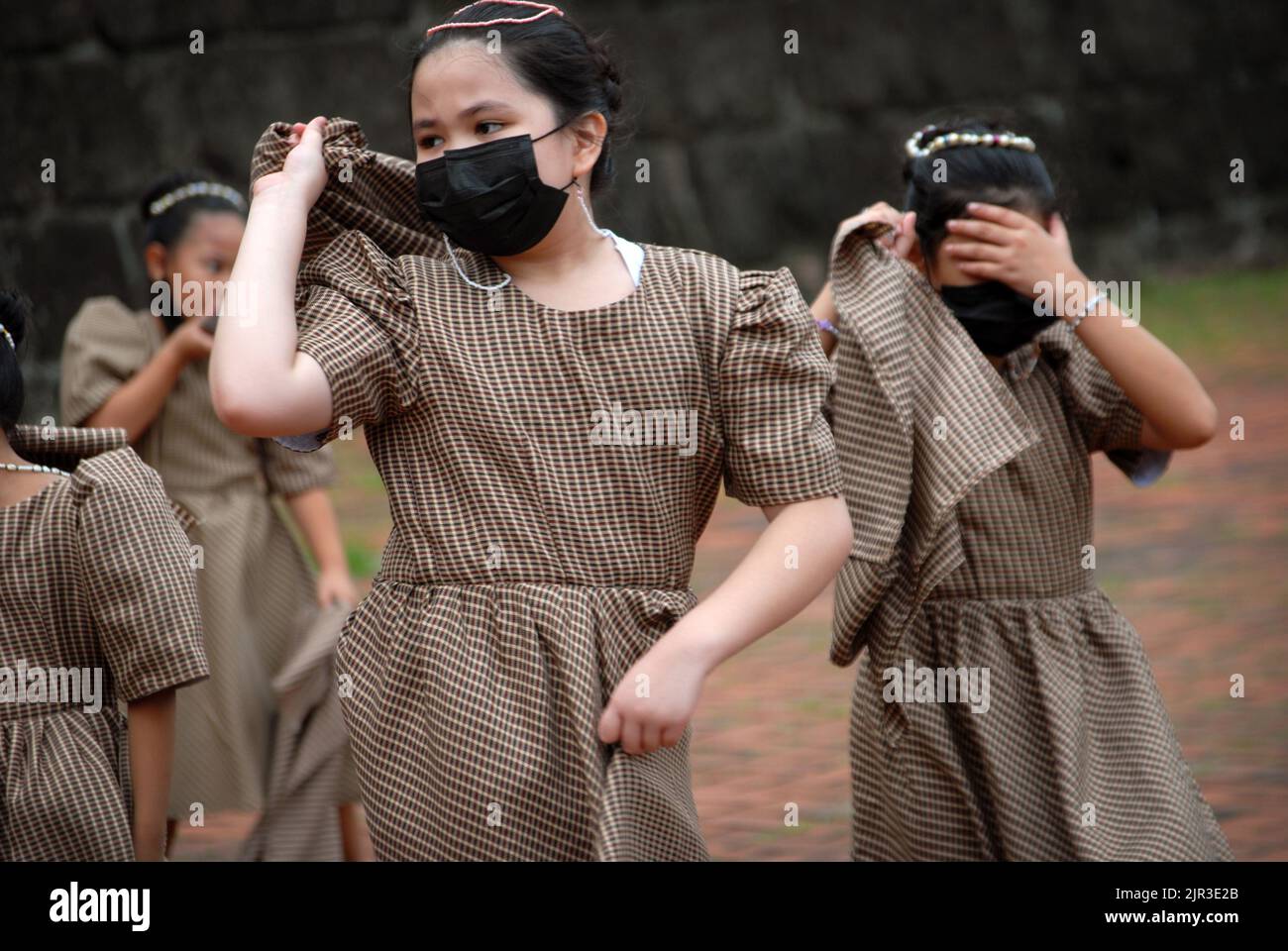 Children dancing as part of religious ceremony, Fort Santiago, Manila ...