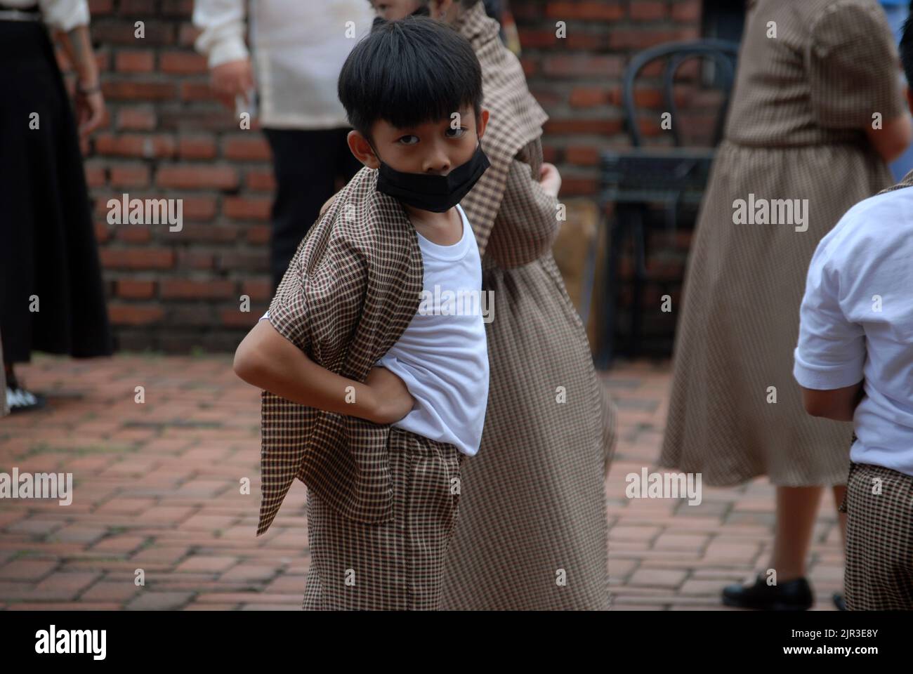 Children dancing as part of religious ceremony, Fort Santiago, Manila ...