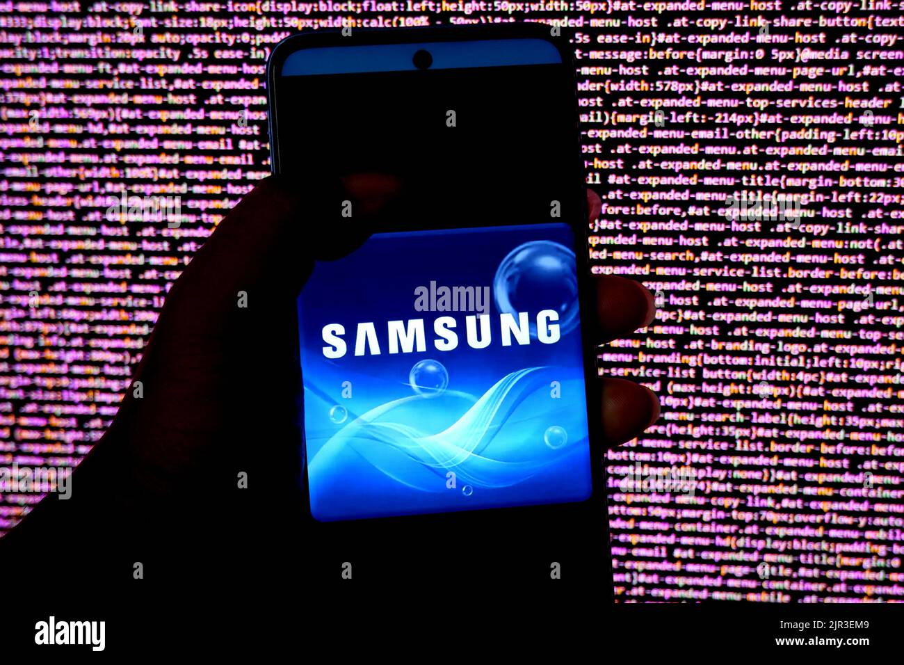 In this photo illustration a Samsung logo seen displayed on an android ...