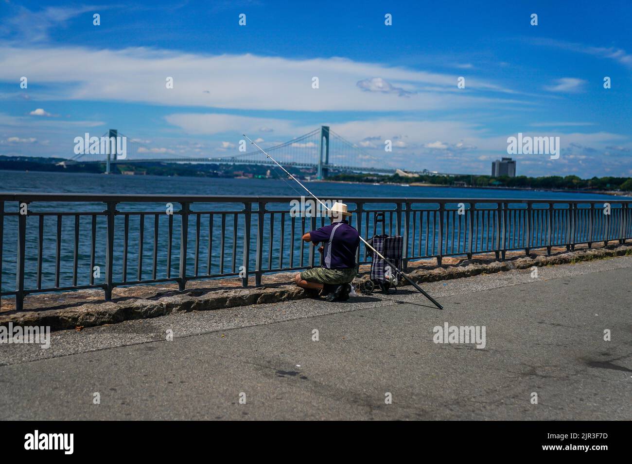 Unidentified fisherman at the Gravesend Bay waterfront in New York's ...