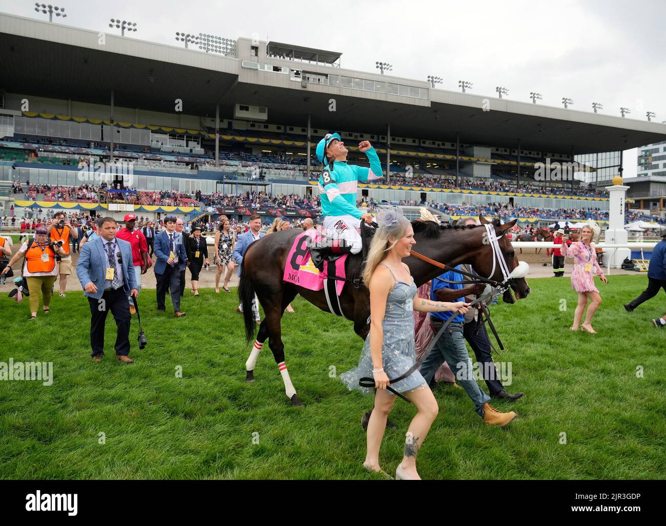 Jockey Rafael Hernandez celebrates as he is led to the winners circle ...