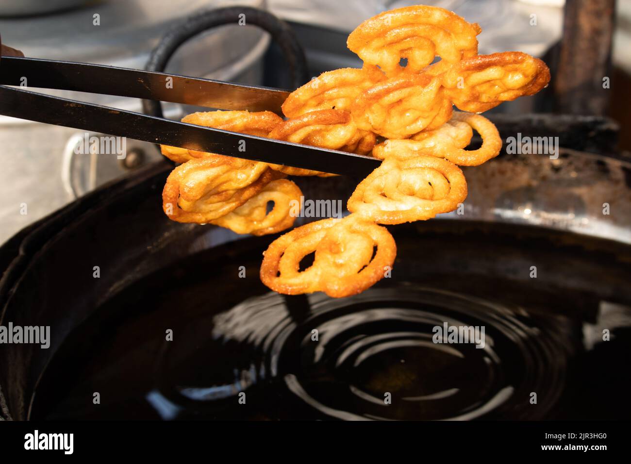 Holding Deep Fried Indian Jalebi Also Known As Jilapi, Jilebi, Jilipi ...