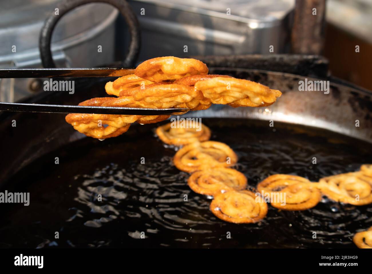 Holding Deep Fried Indian Jalebi Also Known As Jilapi, Jilebi, Jilipi ...