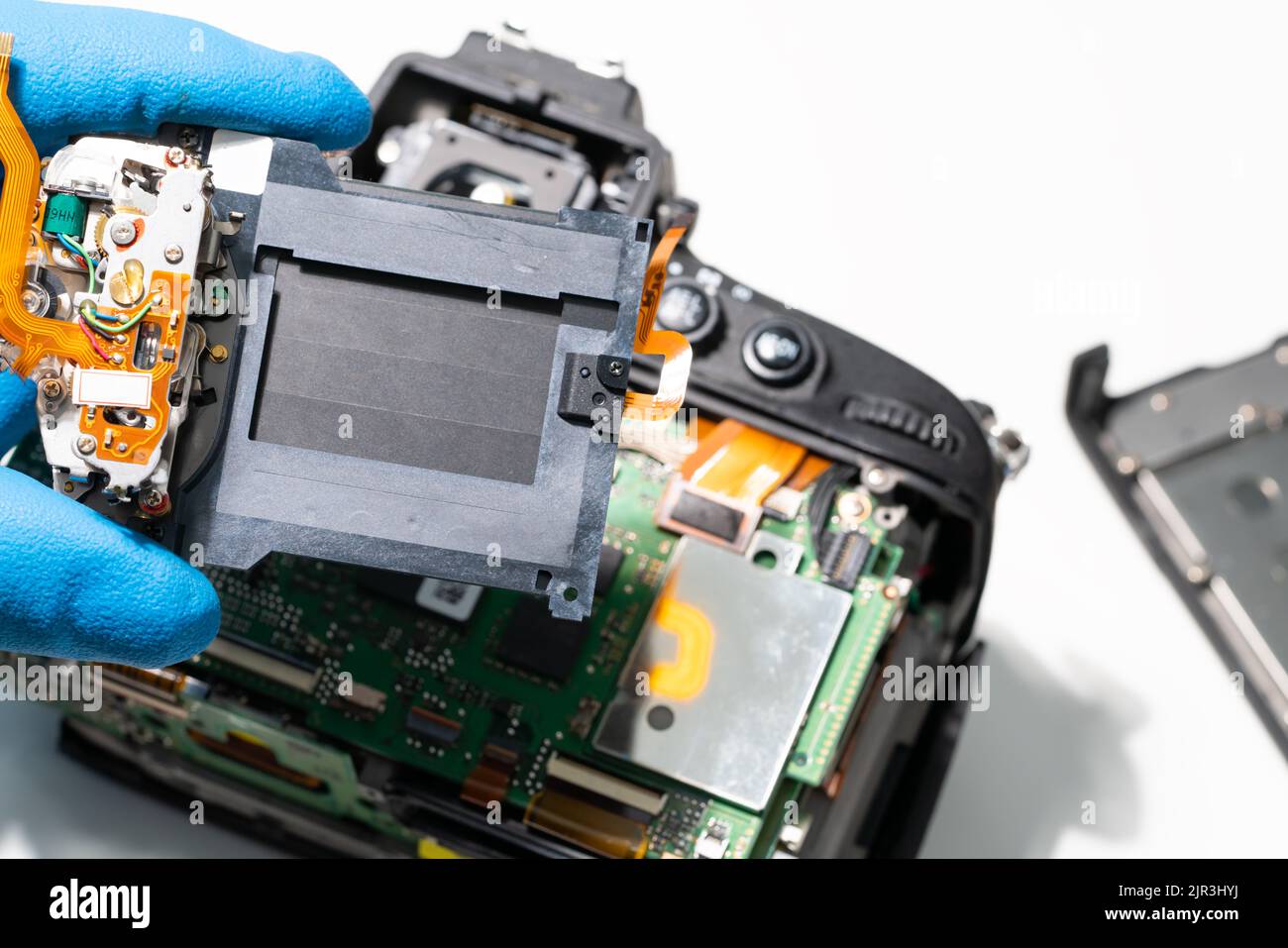 Broken Digital SLR photo camera repair. Replacing the camera shutter ...