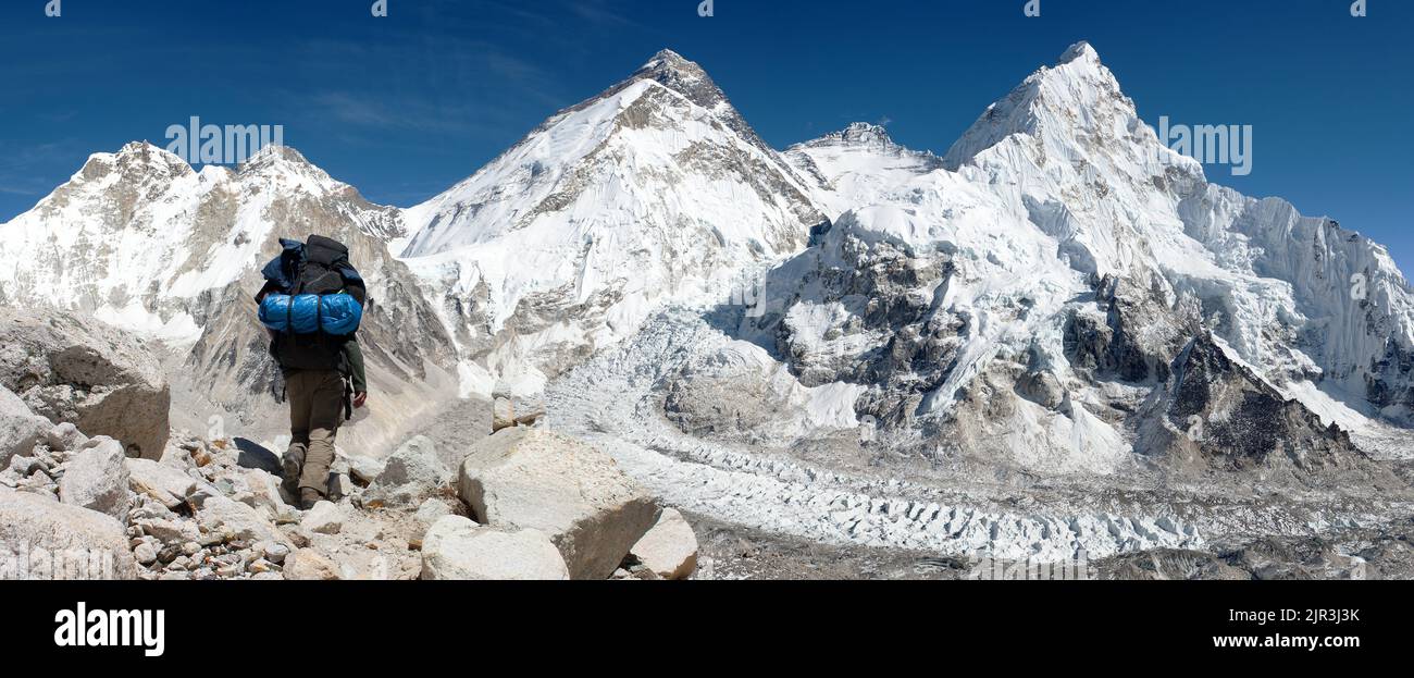 Panoramic view of Mount Everest from Pumo Ri base camp with tourist on ...
