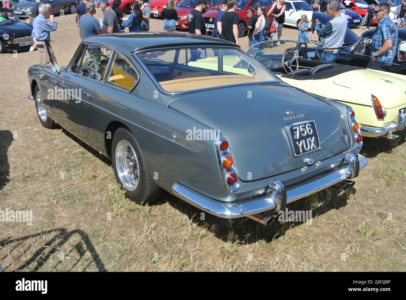 A 1961 Ferrari 250 GTE parked on display at the English Riviera classic ...
