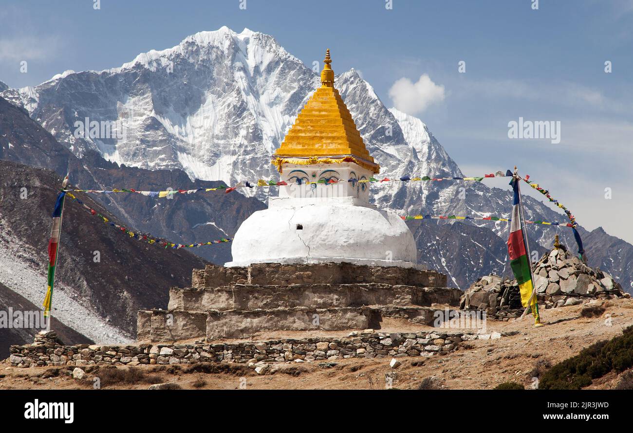 Stupa near Dingboche village with prayer flags and mounts Kangtega and ...