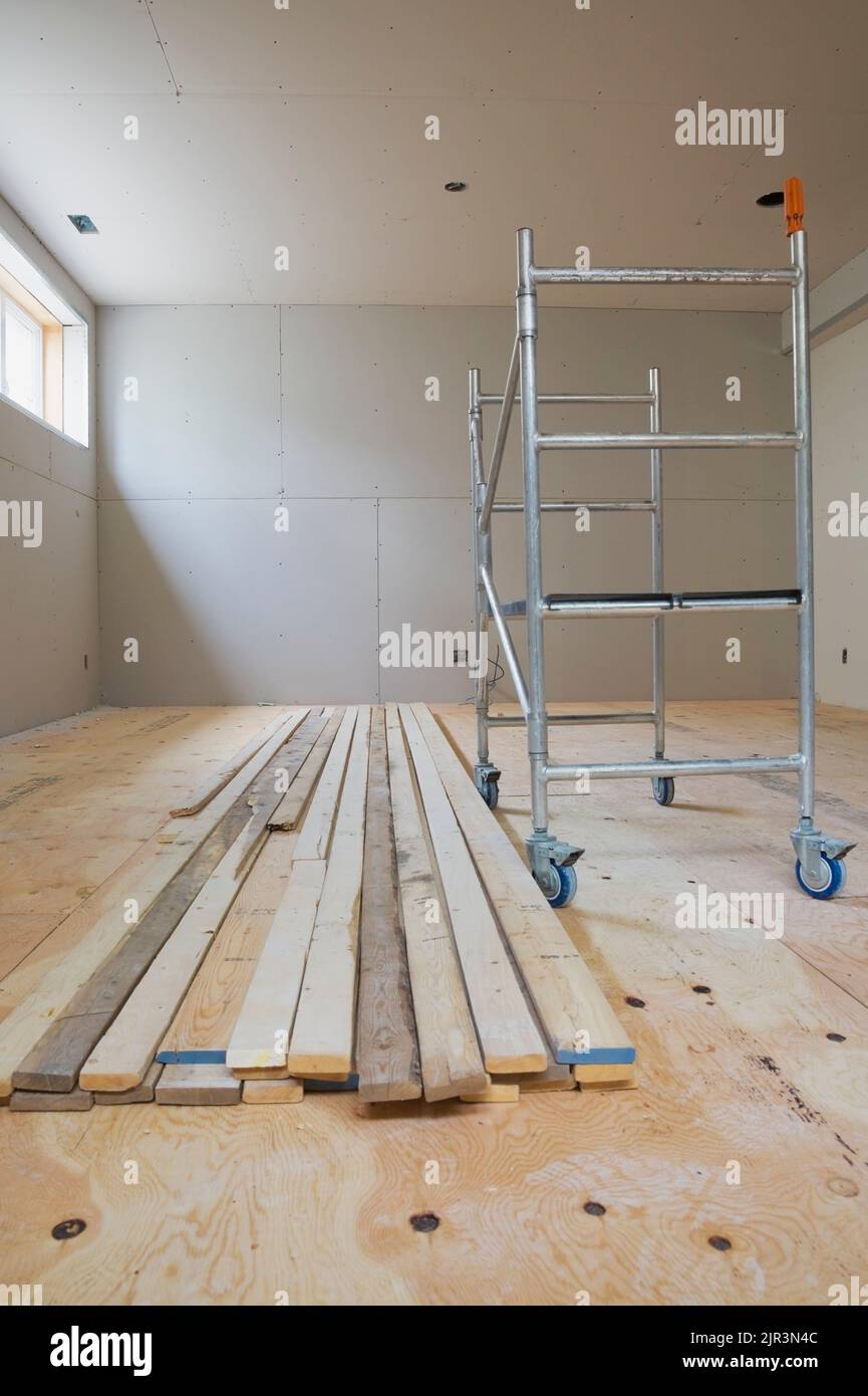 Unfinished basement room with unpainted drywall inside upscale ...