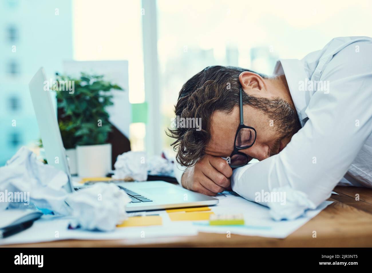 His work performance has taken a dive. a young businessman with his ...