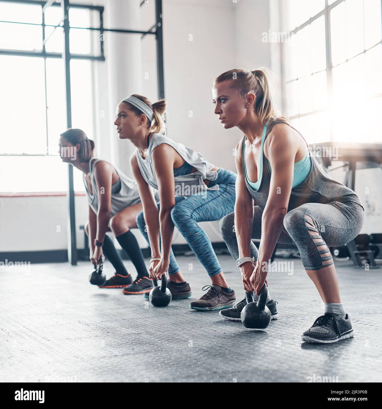 You have the strength to be powerful. three women working out with ...