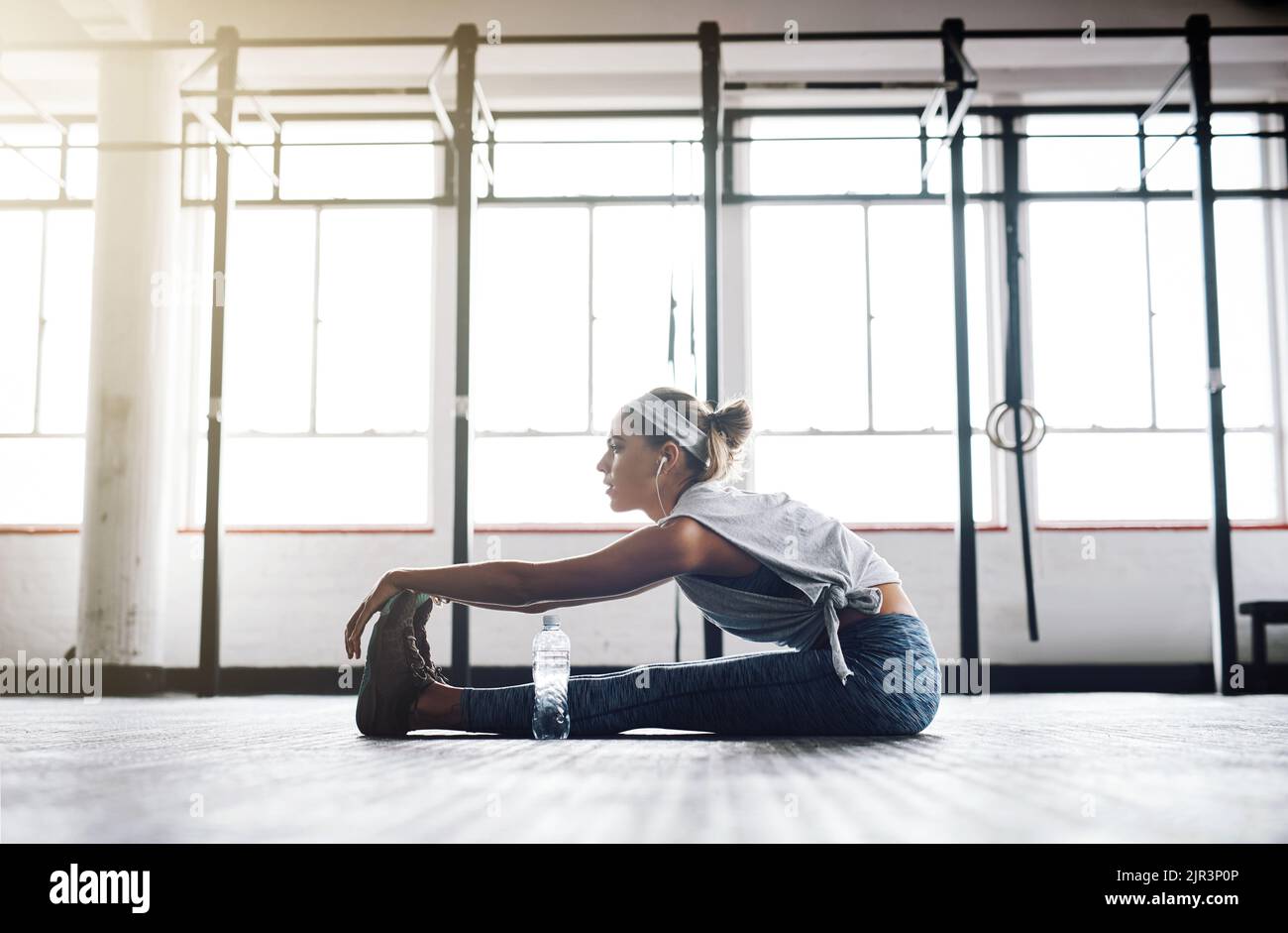 Stretching my legs for the intense workout coming up. an attractive ...