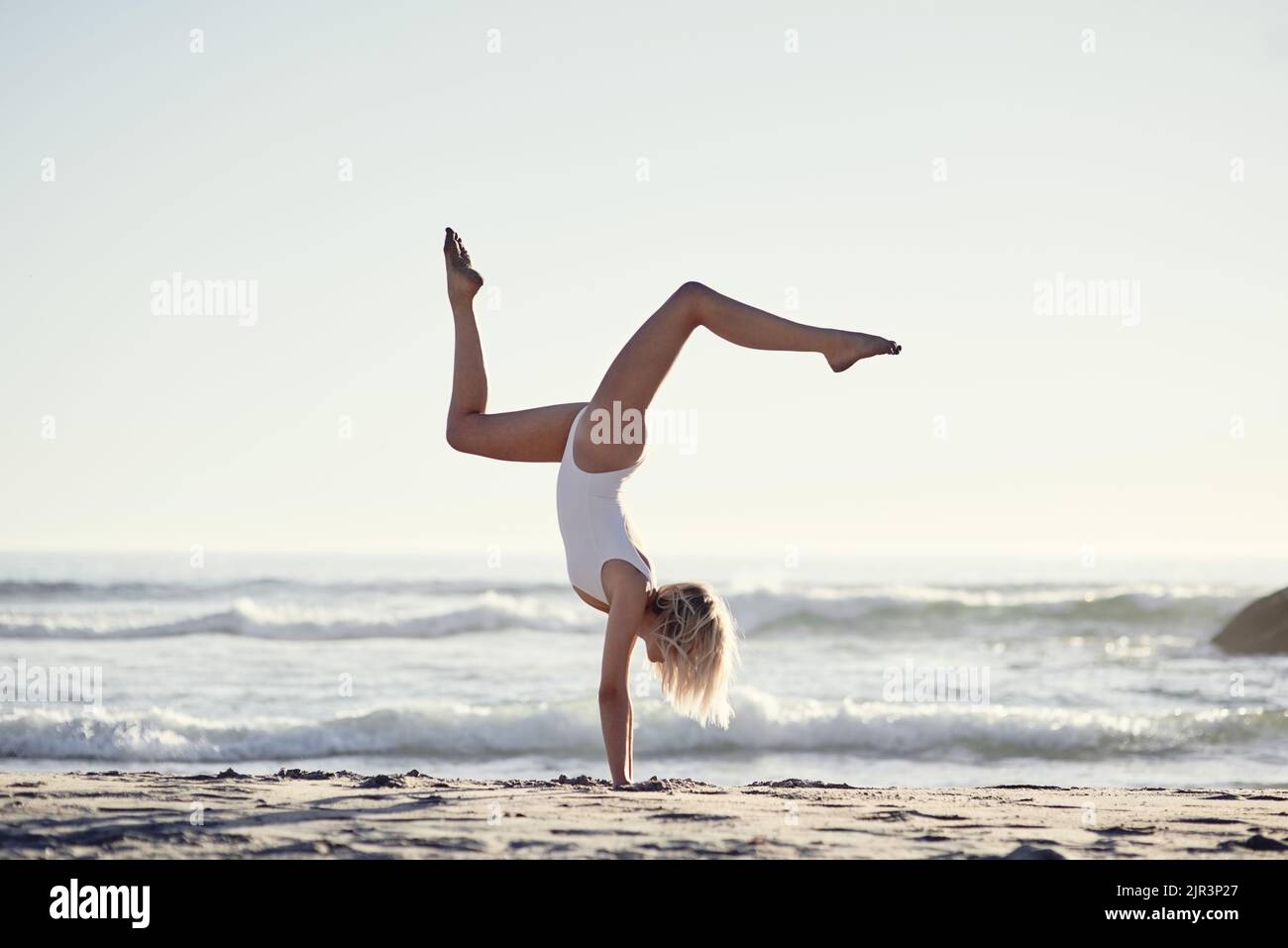 Life is just simpler at the beach. Full length shot of a young woman ...