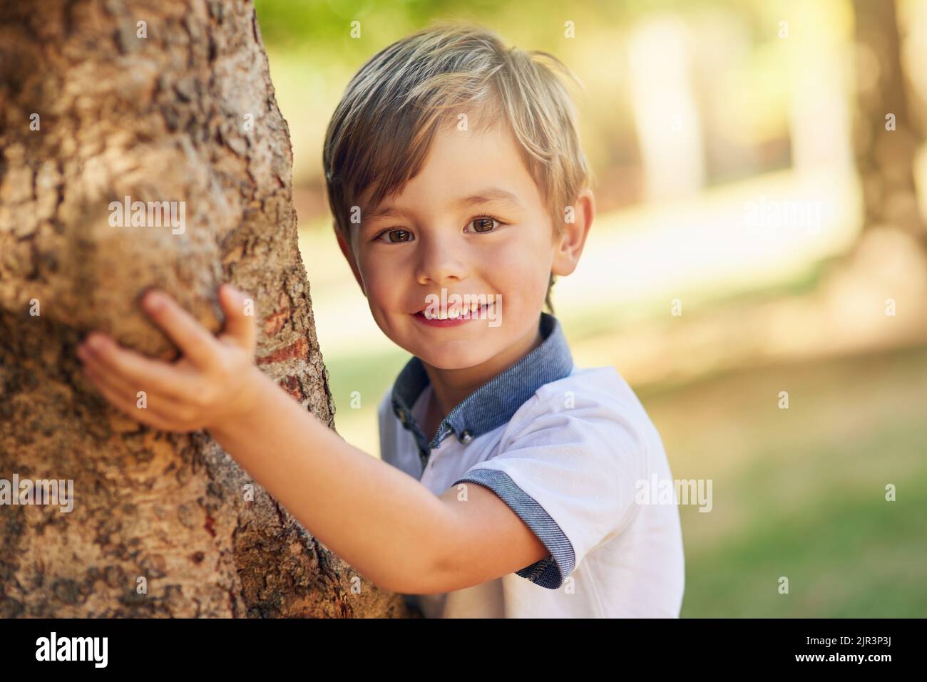 Watch me climb all the way to the top. a happy little boy playing next ...