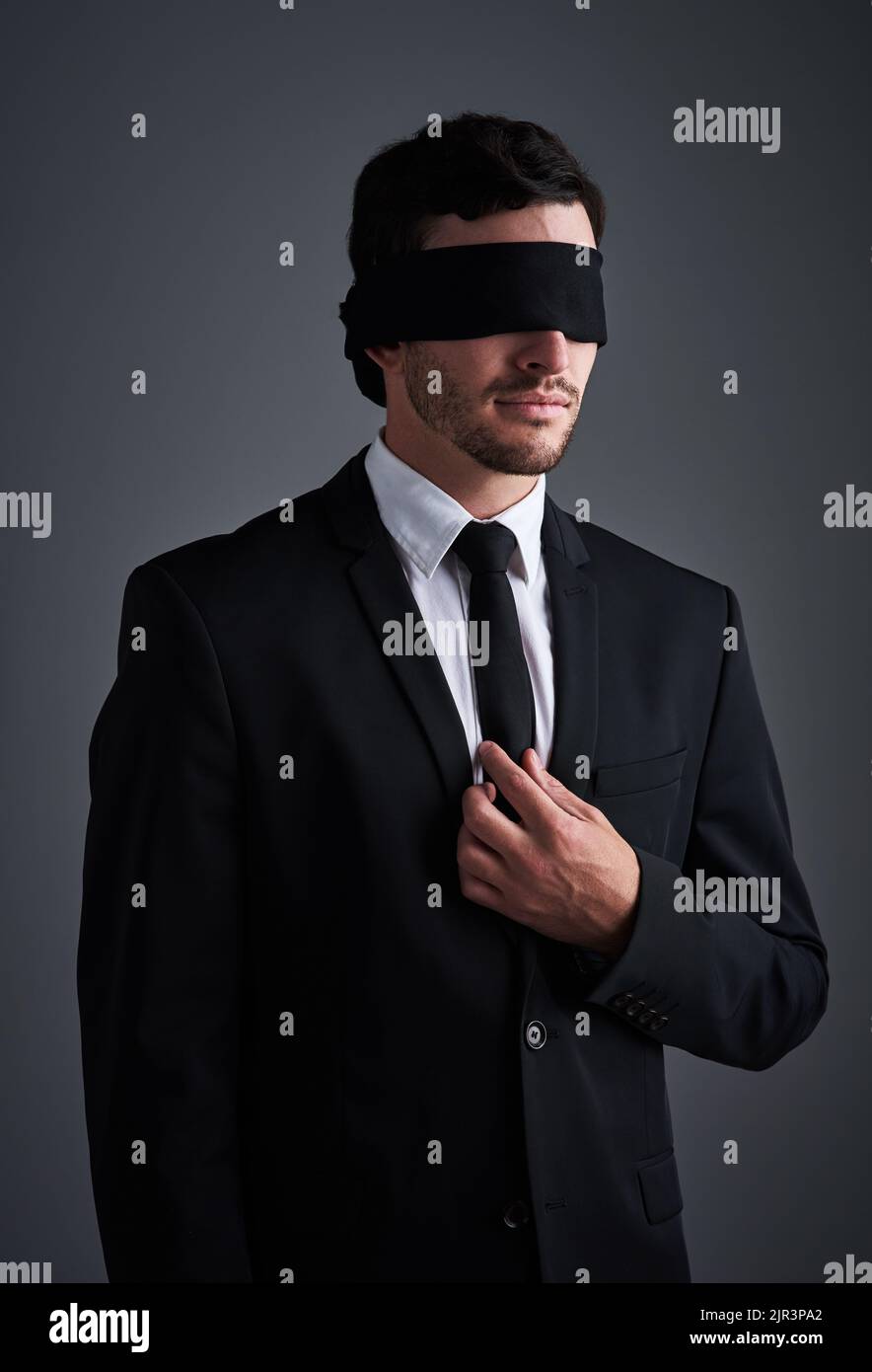 Is your lack of vision limiting you. Studio shot of a young businessman ...