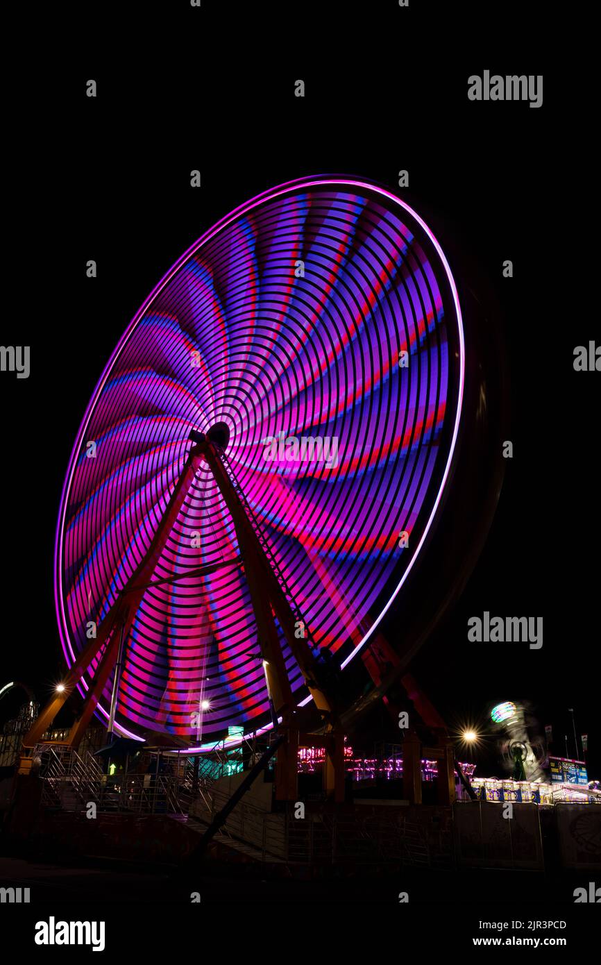 Lights on a spinning ferris wheel at night, Delaware State Fair ...