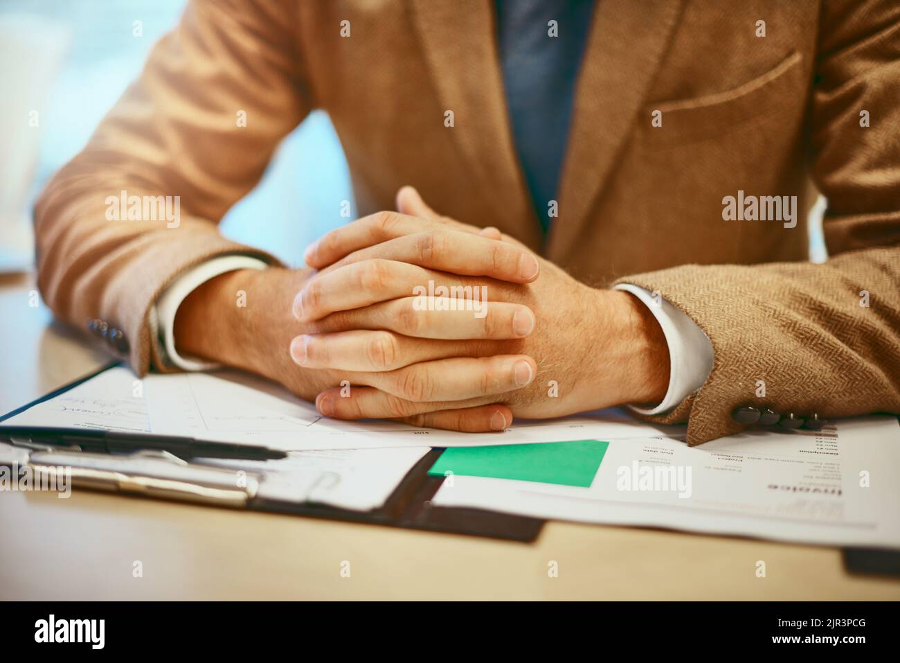 Hes confident and composed. High angle shot of an unrecognizable male ...