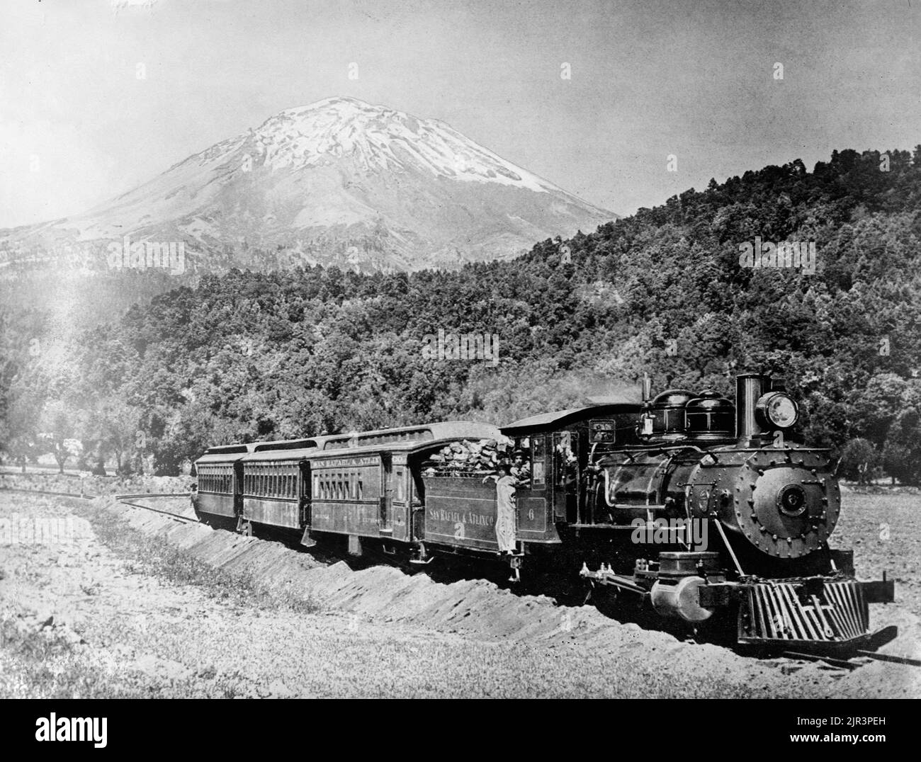 Historical black and white photograph of a steam locomotive and ...