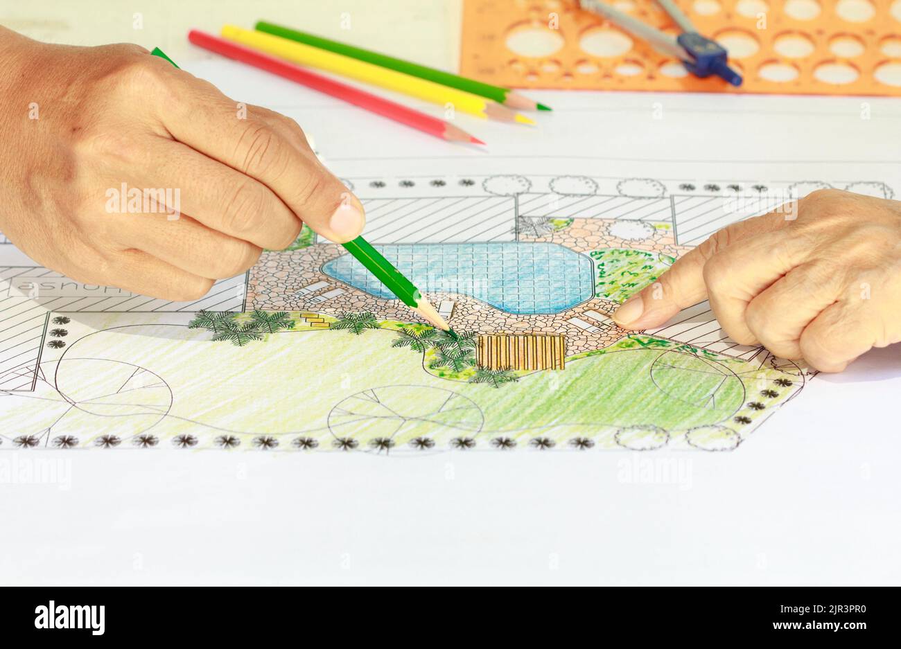 Landscape architect changing drawing at meeting with client Stock Photo ...
