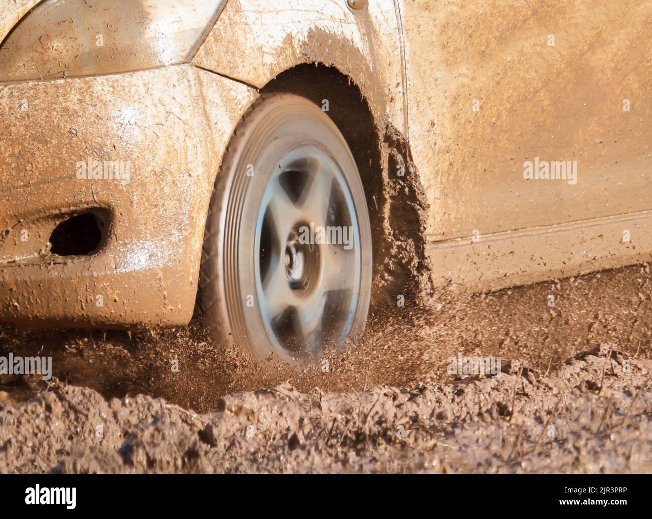 car on muddy road Stock Photo - Alamy