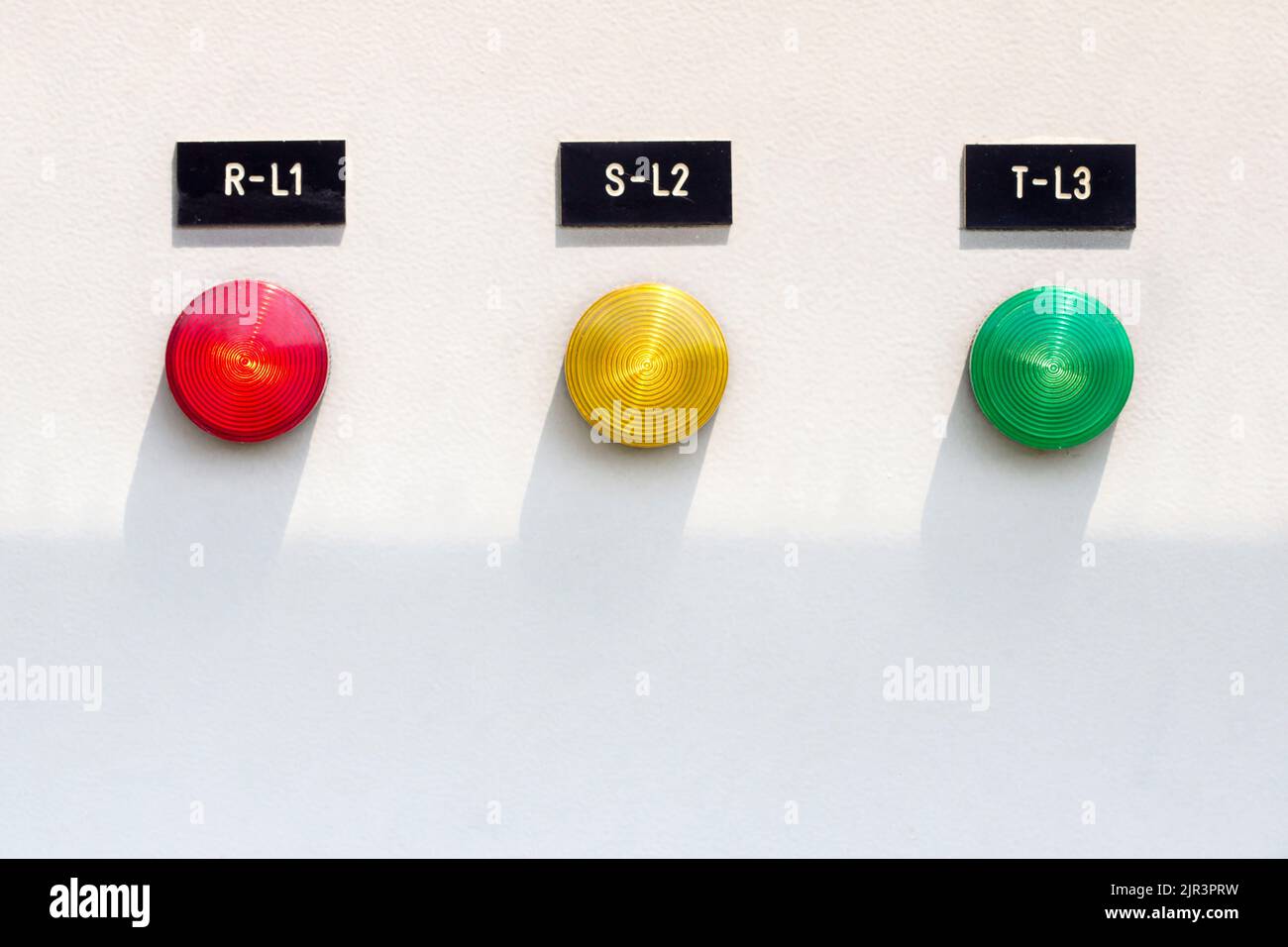 Three phase electric light indicator on control panel Stock Photo - Alamy