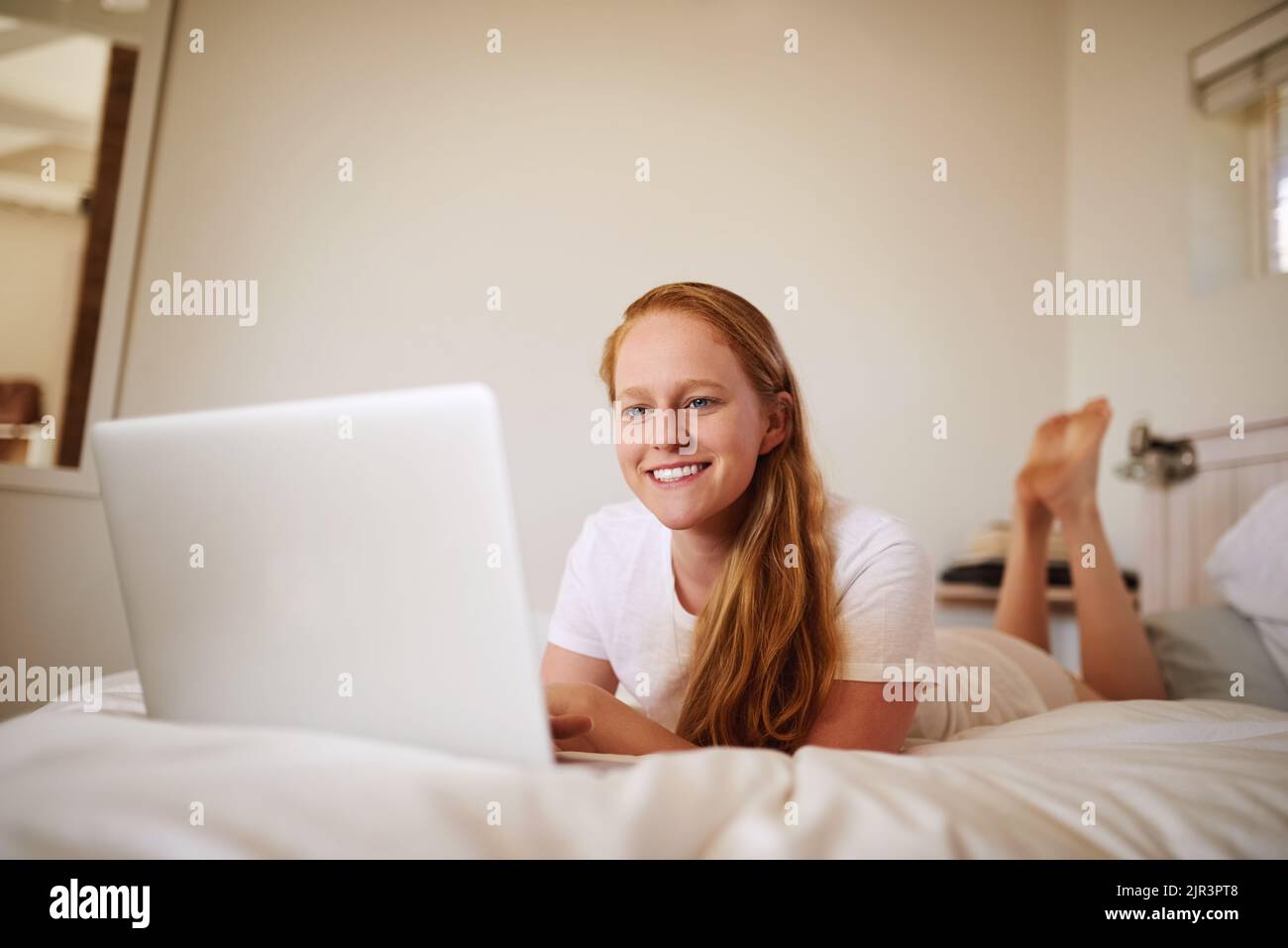 Connectivity is chilling at home and enjoying the internet. a young ...