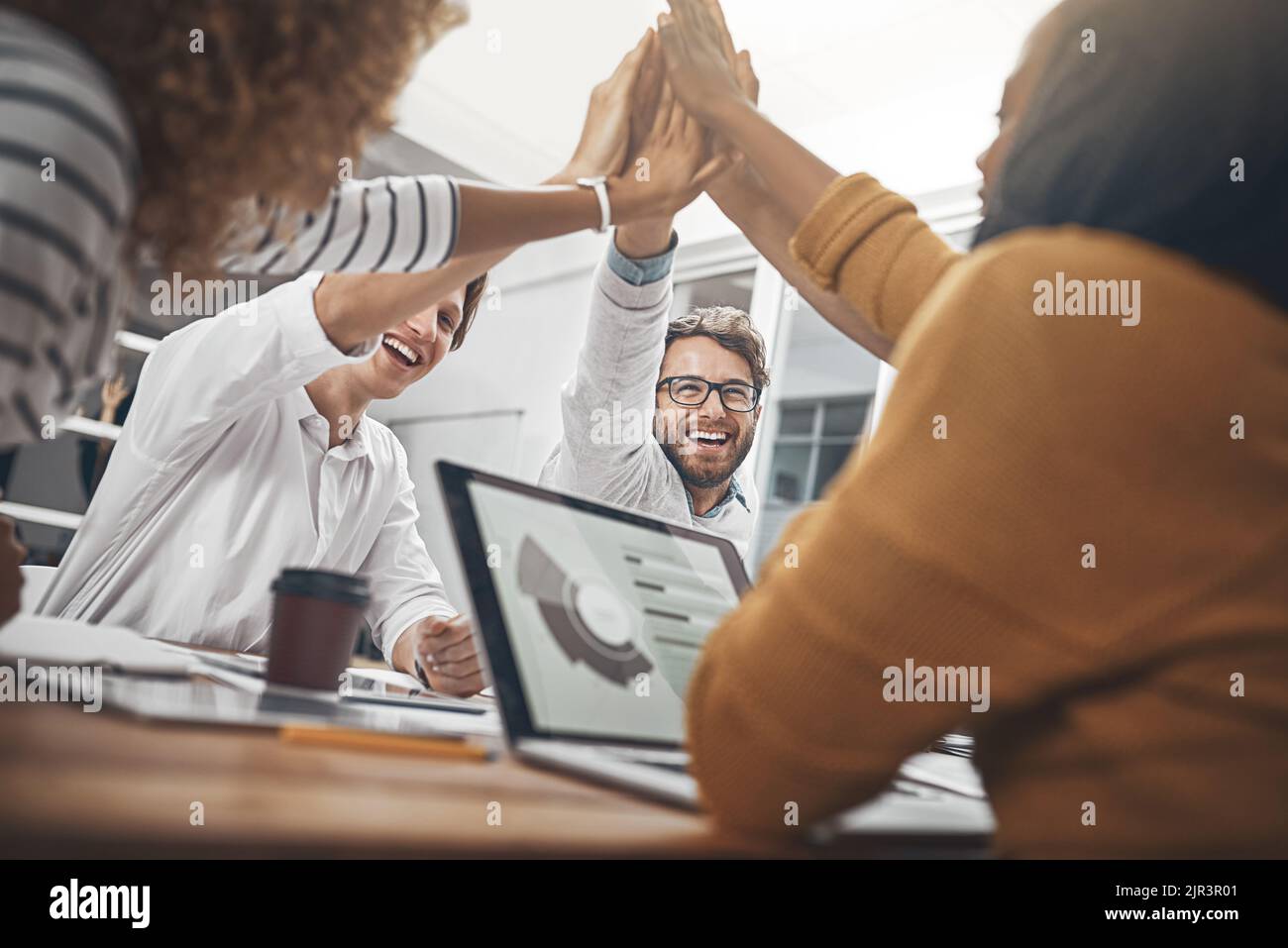 We know we can depend on each other. colleagues high-fiving in the ...