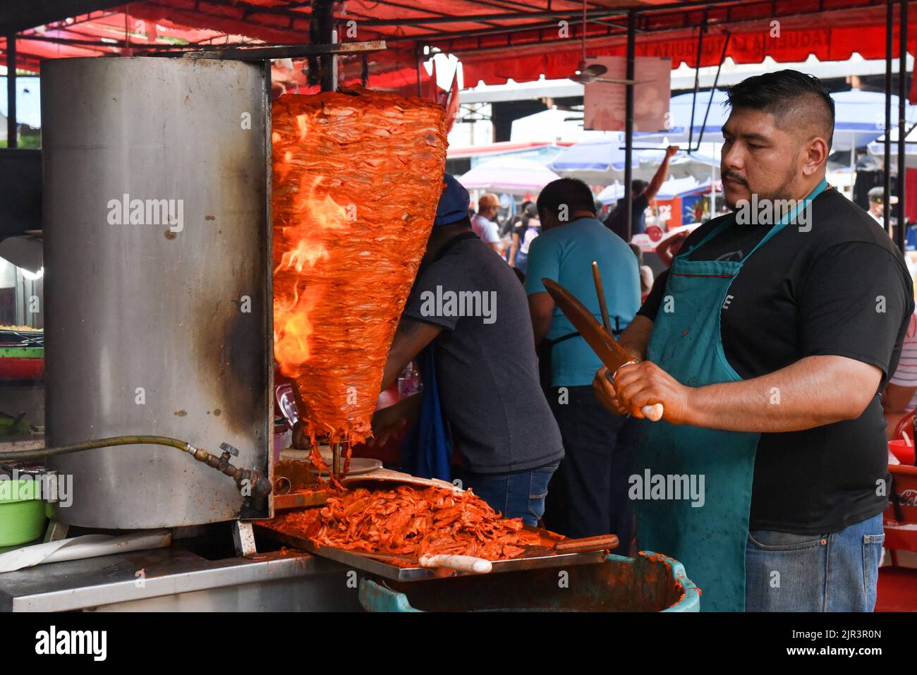 Food vendor preparing Al pastor meat at Lucas de Galvez market, Merida ...