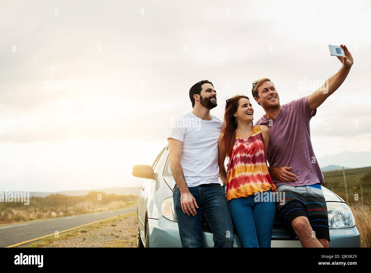 A little to the left. a group young friends getting in close or a self ...