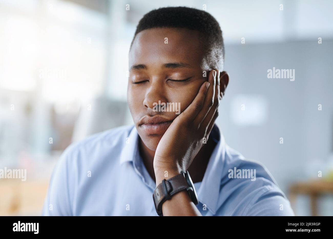 Tired african man sleeping sitting hi-res stock photography and images ...