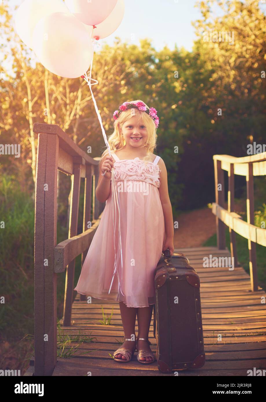 Its time to go paint the world pink. a happy little girl holding ...