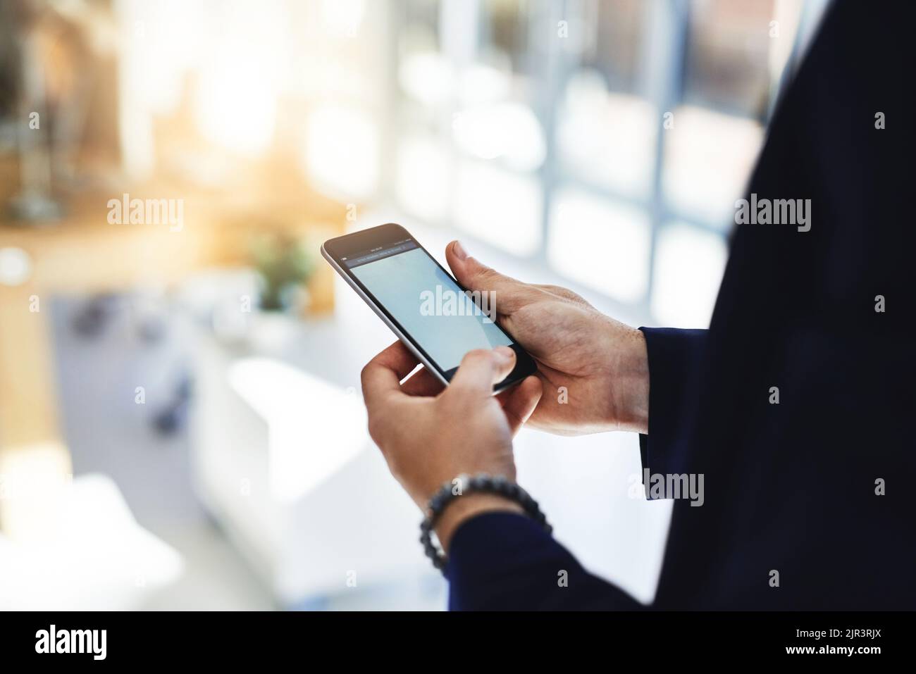 Smart tech gave his business a voice. a businessman using a mobile ...