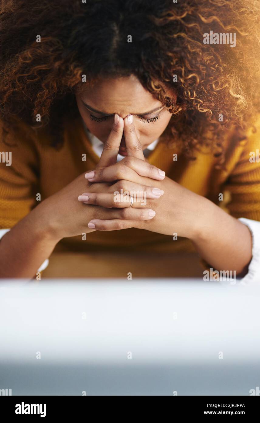 I have to get myself together. a stressed young businesswoman sitting ...