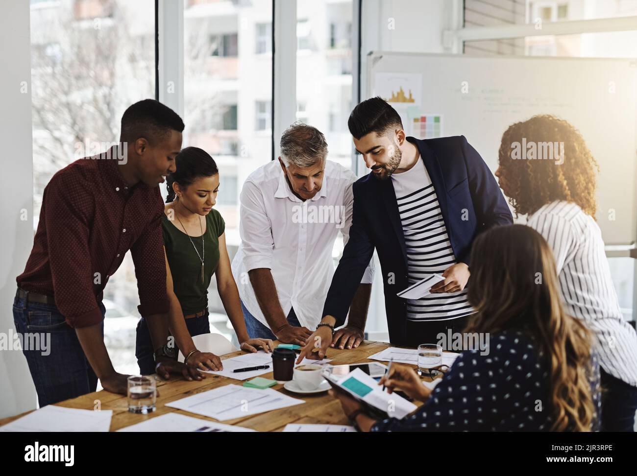 Creativity is intelligence having fun. a group of creative employees ...