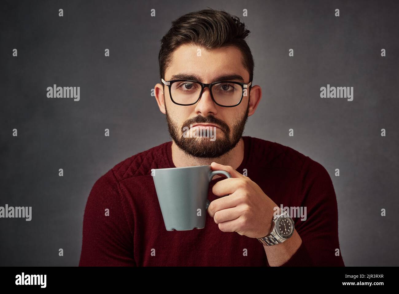 Well boohoo for your sad story. Studio portrait of a handsome young man ...